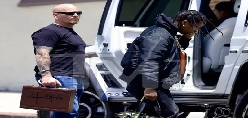 Travis Scott's Security Guard Rocks Handcuffed "Utopia" Briefcase ...